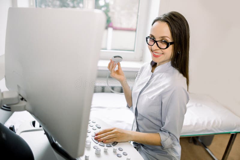 Skillful Professional Woman Doctor Sonographer Using Ultrasound Machine ...