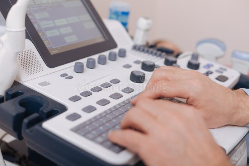 Skillful Sonographer Using Ultrasound Machine At Work Stock Photo ...