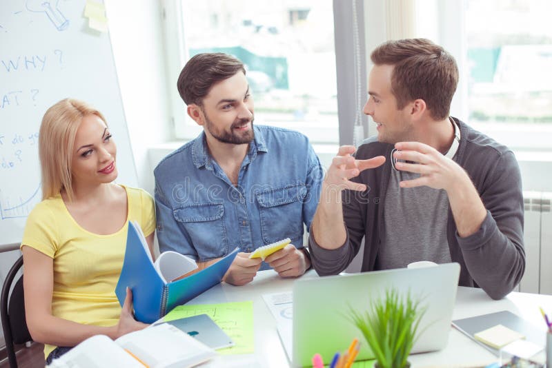 Skillful Three Workers are Speaking in Office Stock Photo - Image of ...