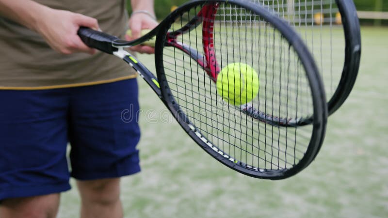 Skillfull Tennis Player Doing Tricks with Two Rackets Stock Video ...