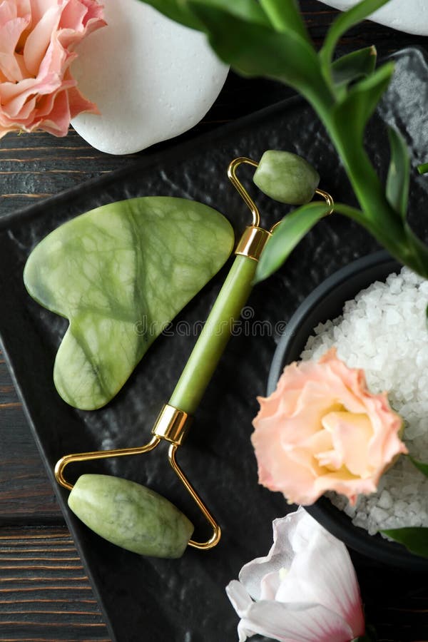 Skin Care Concept with Face Roller on Wooden Table Stock Photo - Image ...