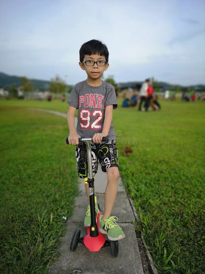 Skinny kid with scooter stock image. Image of skinny - 140109145