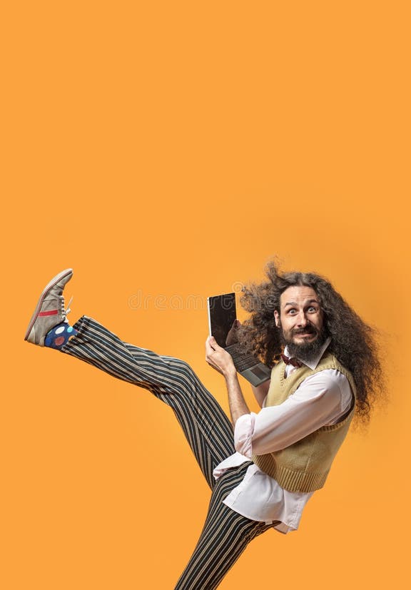 Skinny Nerd Jumping with a Notebook Stock Photo - Image of hacker ...