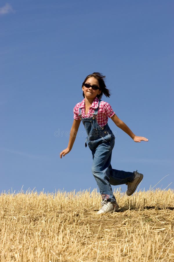 Skipping Happily in a Field. Stock Photo - Image of beauty, field: 16054652