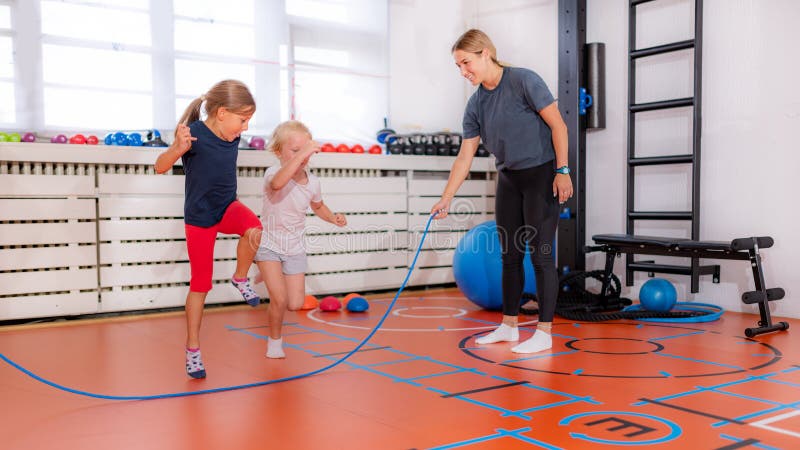 Limbo or Laser Game for Children, Little Girls Having Fun in a Physical ...