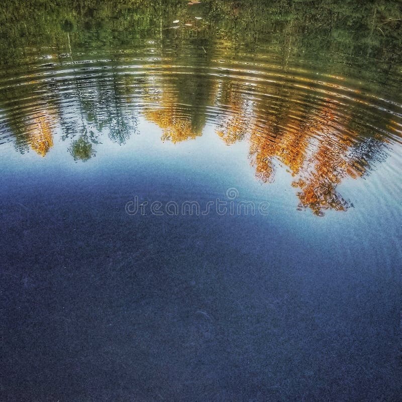 Skipping a River Rock To Make Ripples Stock Image - Image of reflection ...