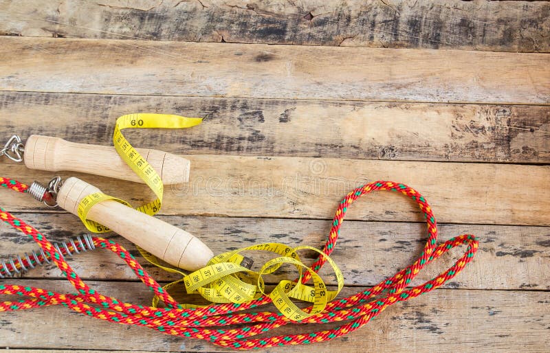 Skipping Rope and Measuring Tape on Wooden Table Stock Photo - Image of ...