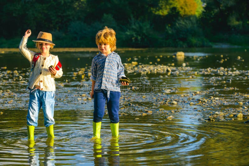 Skipping Stones on Water. Children in Action of Throwing Stone or Rock ...