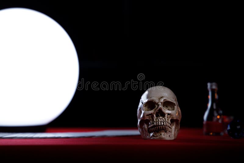 Skull on Table in Dark Room. Stock Image - Image of bright, dead: 196782779