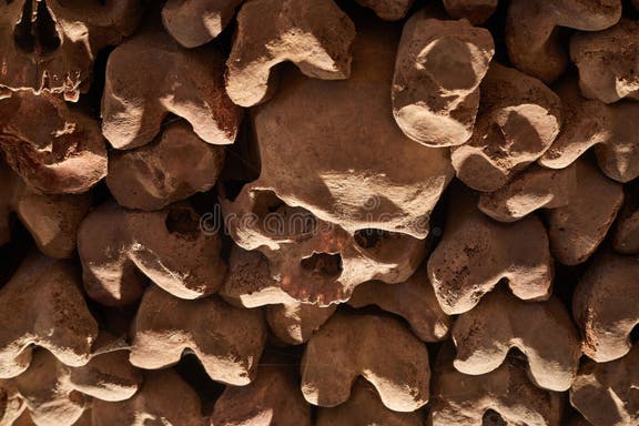 Skulls and bones in a wall stock photo. Image of crypt - 230465848