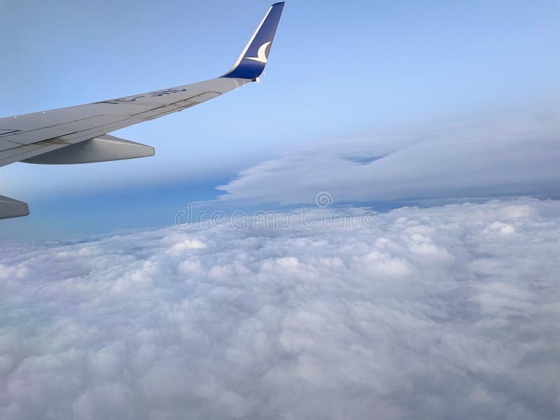 On the Sky. Airplane Wing and White Clouds.View of the Sky and the Wing ...