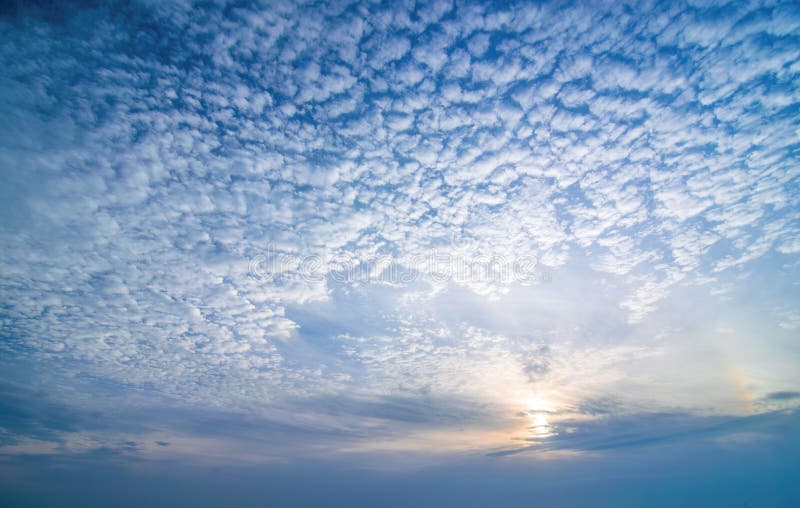 Sky Background with Low Sun and Cirrocumulus Clouds Stock Image - Image ...