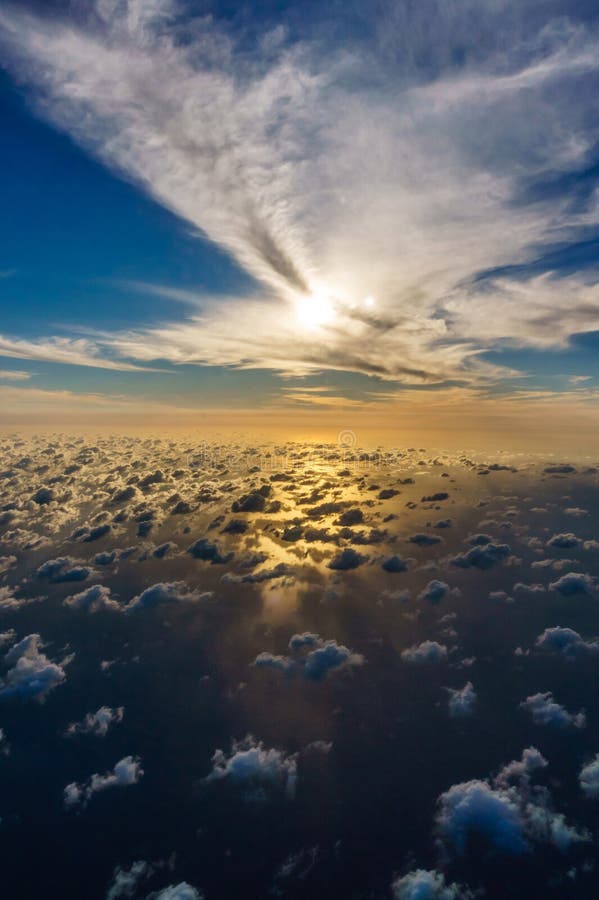 The Sky is Blue with a Few Clouds and the Sun is Setting Stock Photo ...