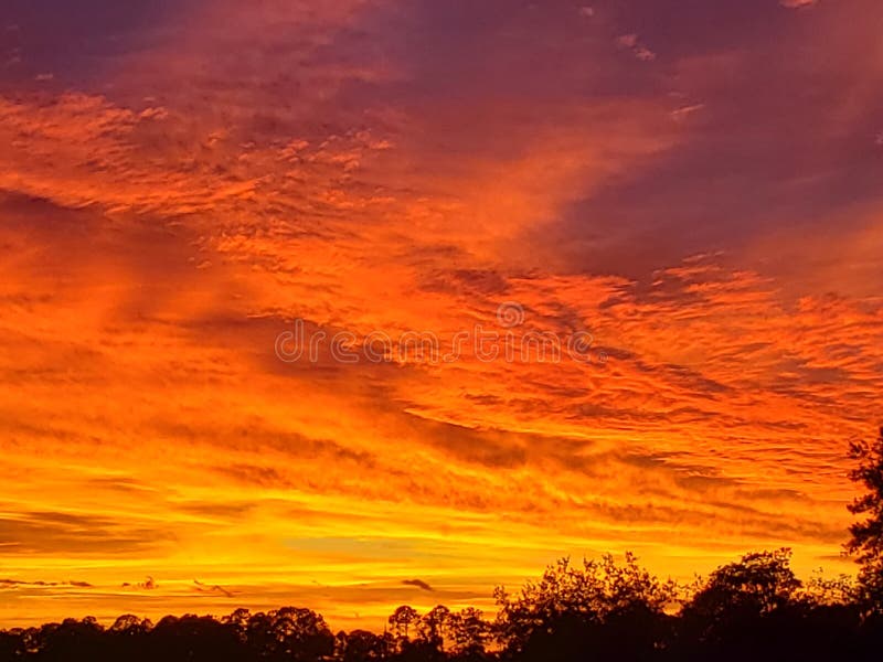 The sky caught fire stock photo. Image of sunset, amazing - 161866914