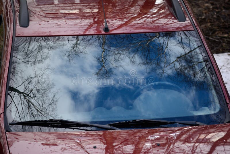 Sky of a Cloud and Trees Reflected in a Windshield of the Car of ...