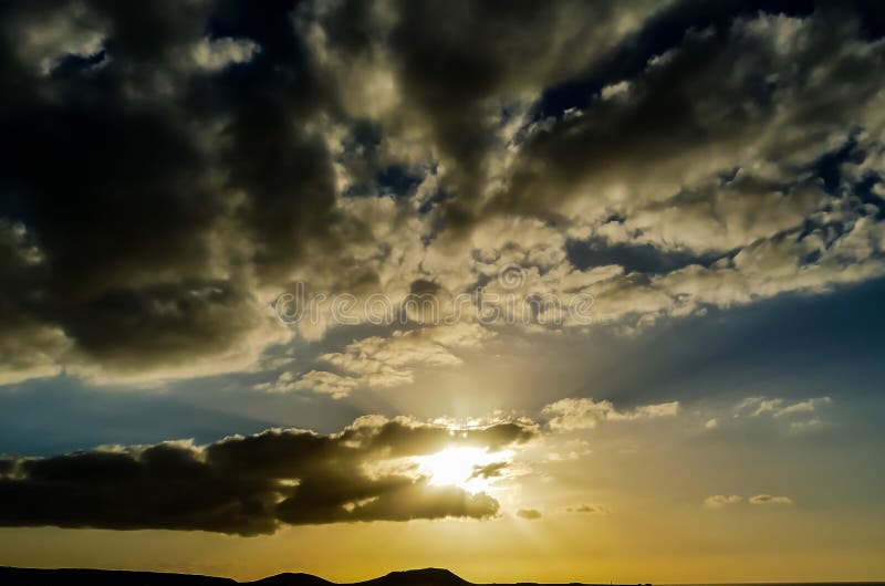 The Sky is Cloudy and the Sun is Setting Stock Photo - Image of ...