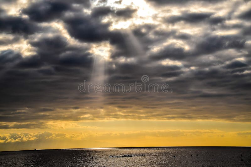 The Sky is Cloudy and the Sun is Shining through the Clouds Stock Photo ...