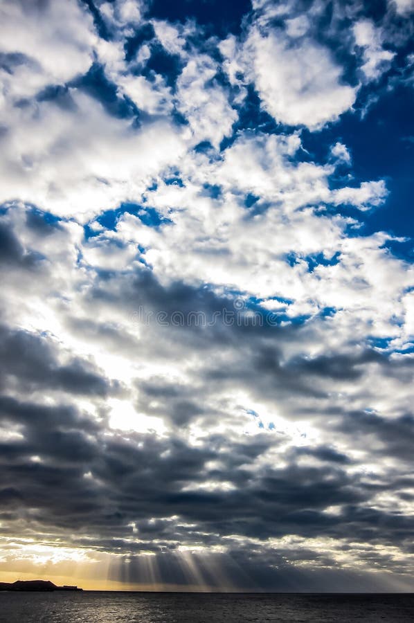 The Sky is Cloudy and the Sun is Shining through the Clouds Stock Photo ...