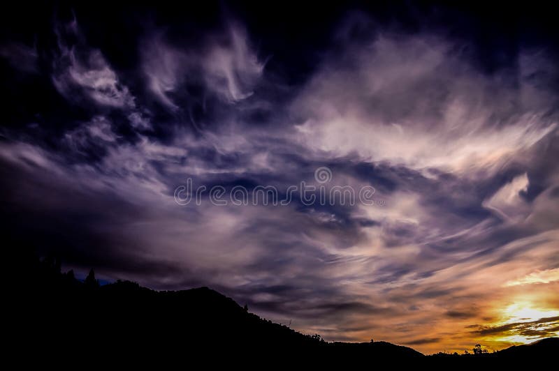 The Sky is Dark and Cloudy with a Few Clouds in the Distance Stock ...