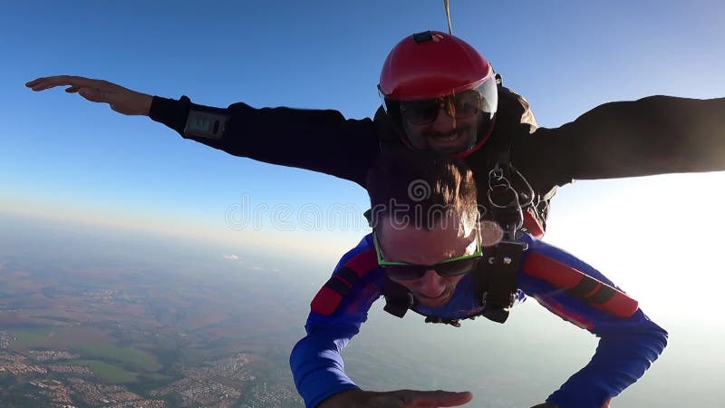 Sky Dive Tandem Friends at the Sunset Stock Video - Video of hands ...