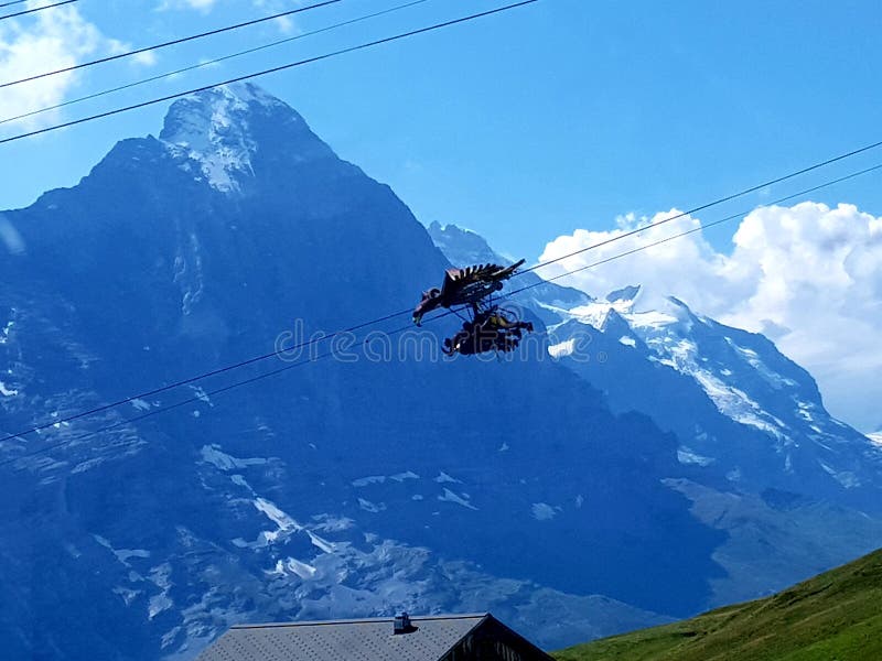 Sky flying in the alps stock photo. Image of alps, wire - 149402894