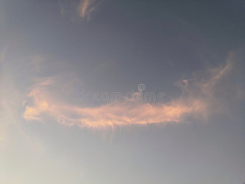 Faint Clouds in a Blue Sky Above the Crest of a Hill with Bleached ...