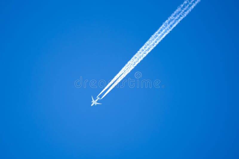 Sky is Illuminated with Vapor Trails from a Jet, Creating a Beautiful ...