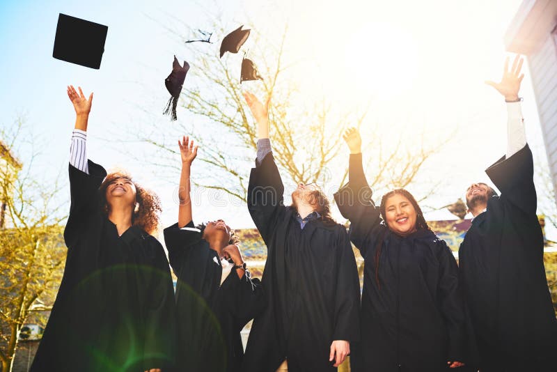 The Sky is the Limit. a Group of Students Throwing Their Caps into the ...