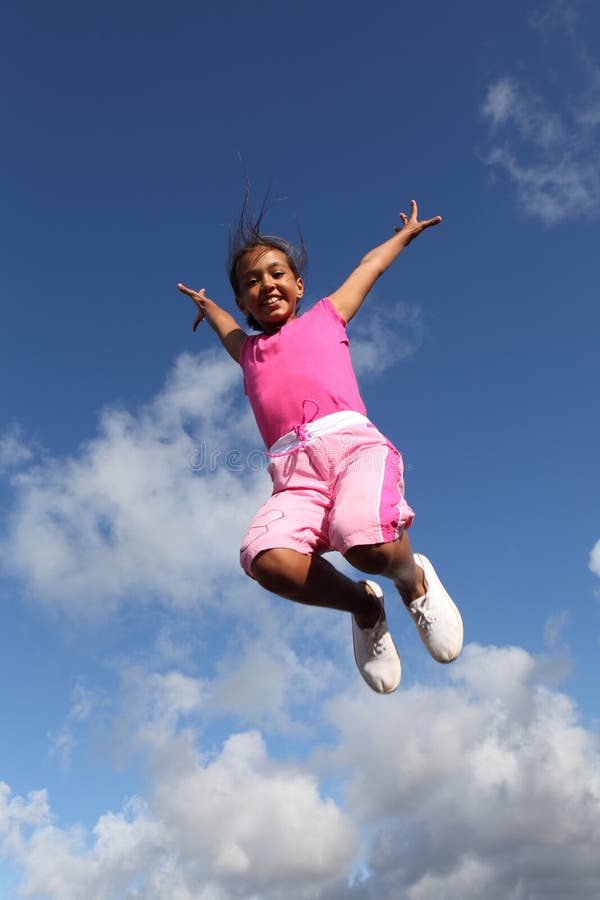 Sky is the Limit Jump for Joy by Young School Girl Stock Image - Image ...