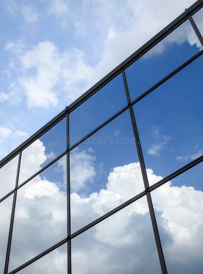 Sky mirrored in windows stock photo. Image of background - 140659848