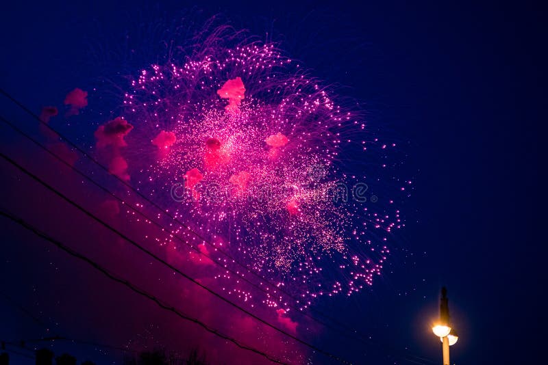 The Sky is with Pink Fireworks, Wires and a Lamp Post Stock Image ...