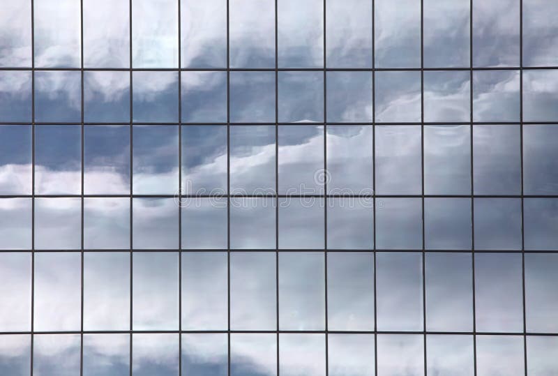 Sky Reflecting in Windows of Office Building Stock Photo - Image of ...