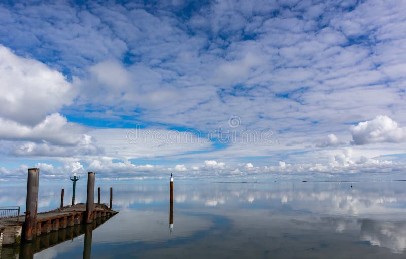 Sky Reflection in Calm Water Stock Photo - Image of mirror, blue: 190934106