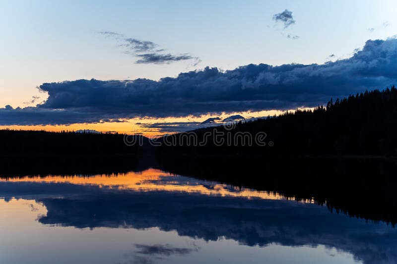 Sky Reflection in the Lake at the Scenic Forest on a Beautiful Sunse ...