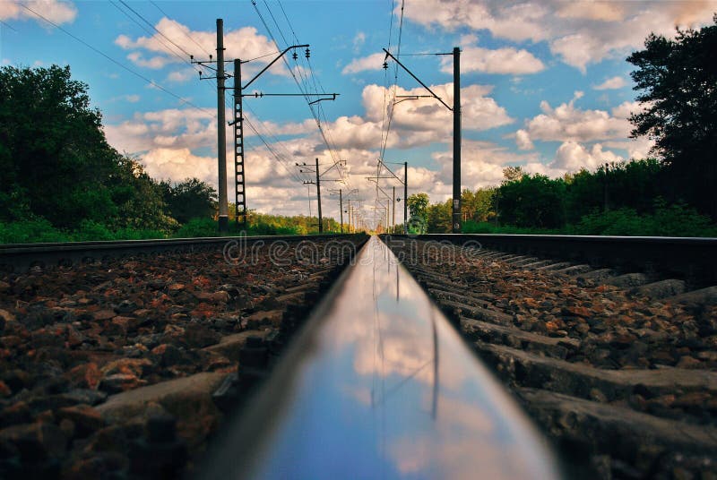 Sky Reflection on Railroad Tracks Stock Photo - Image of railroad, walk ...