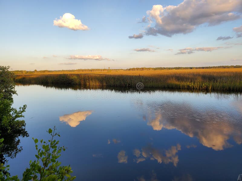 Sky Reflections Across Calm Waters of the Marsh 3 Stock Image - Image ...