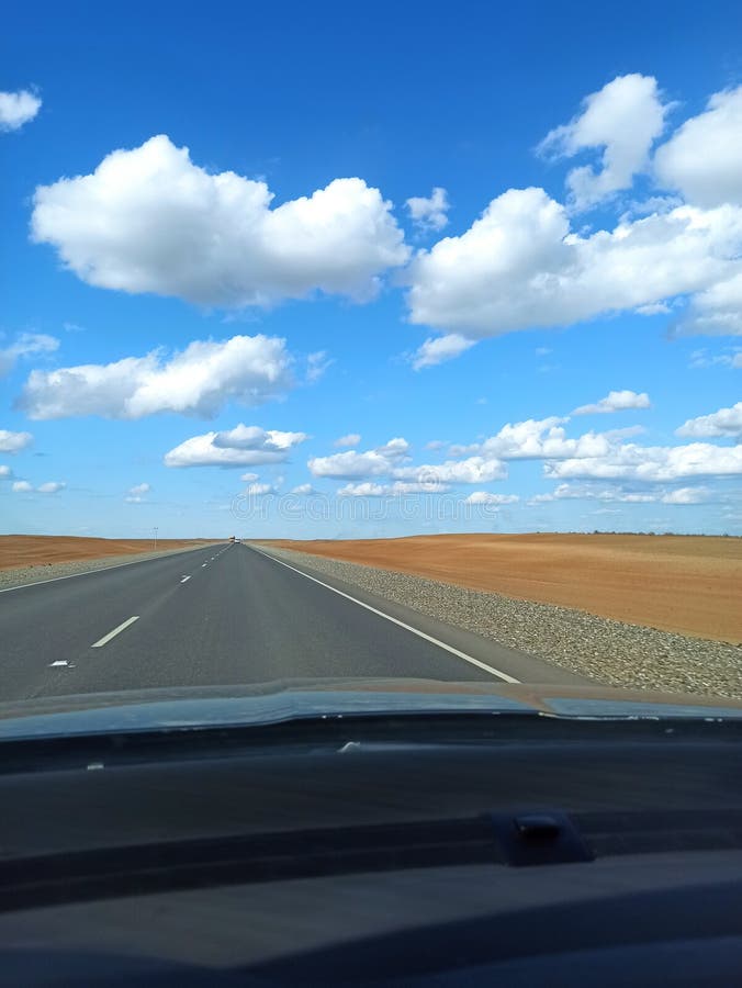 Sky, road, wind stock photo. Image of blue, cloud, road - 219368604