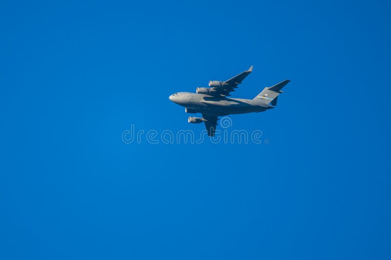 Four-engine War-plane Flying in Clear Blue Sky, Military Airplane Stock ...