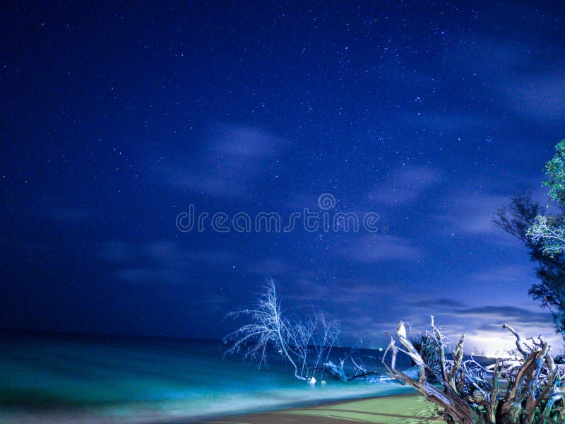 Beautiful Star on the Night Sky and Bright Cloud Over the Beach Stock ...