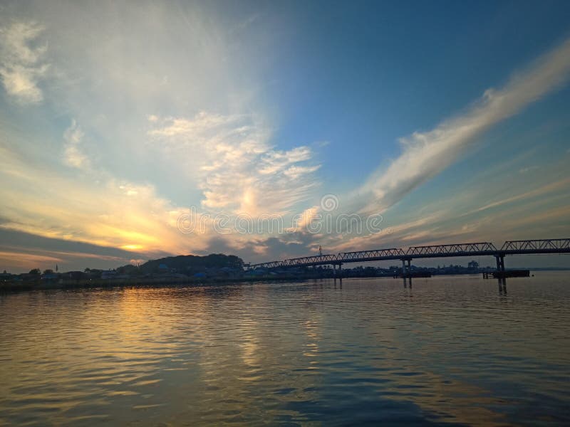 The Sky when the Sun Will Rise in the River with the Bridge Stock Image ...