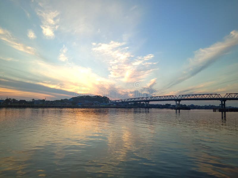 The Sky when the Sun Will Rise in the River with the Bridge Stock Image ...