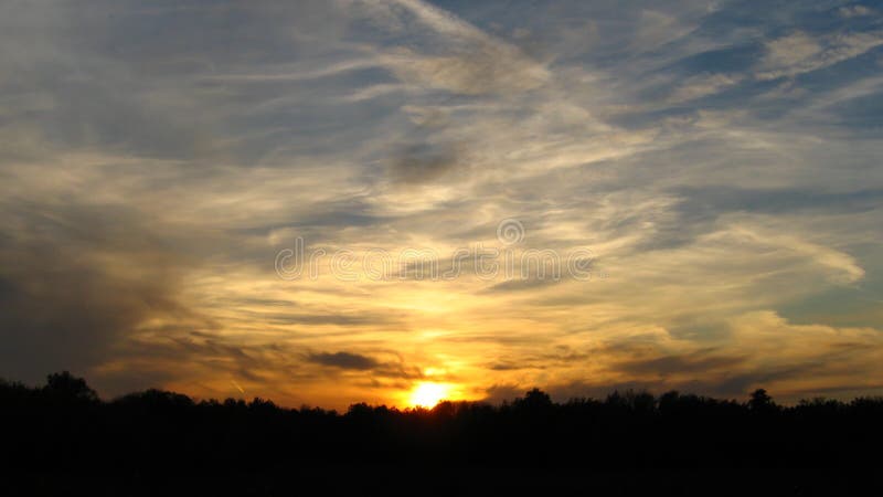 Sunset over the flatland stock photo. Image of evening - 234273152