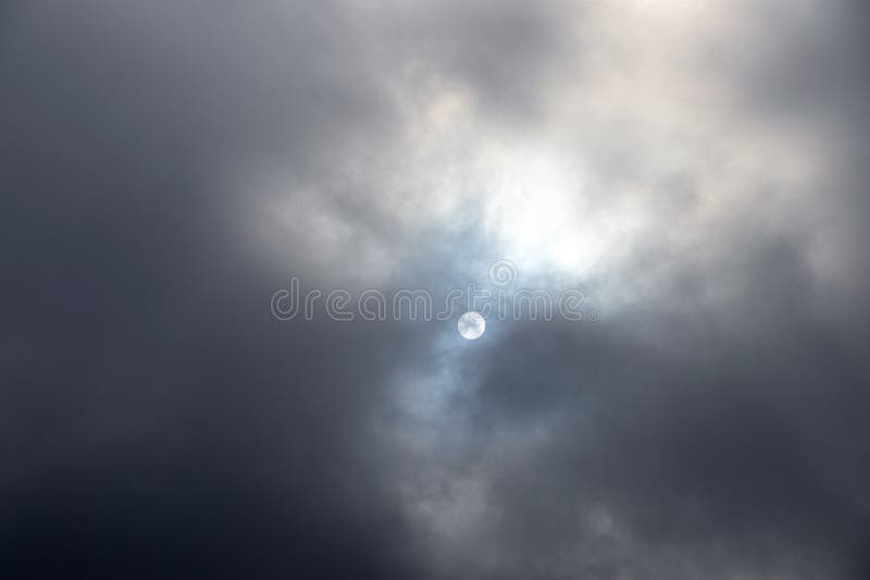 The Sky with Thick Dark Clouds, through Which the Sun Can Barely See ...