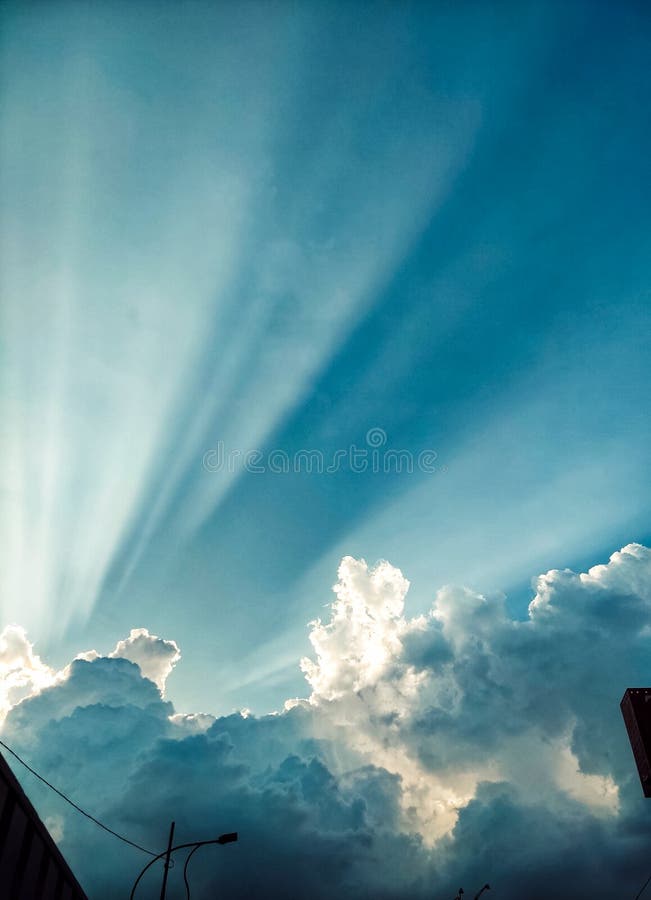 View of Sunbeam Behind the Clouds Stock Photo - Image of sunlight, grey ...