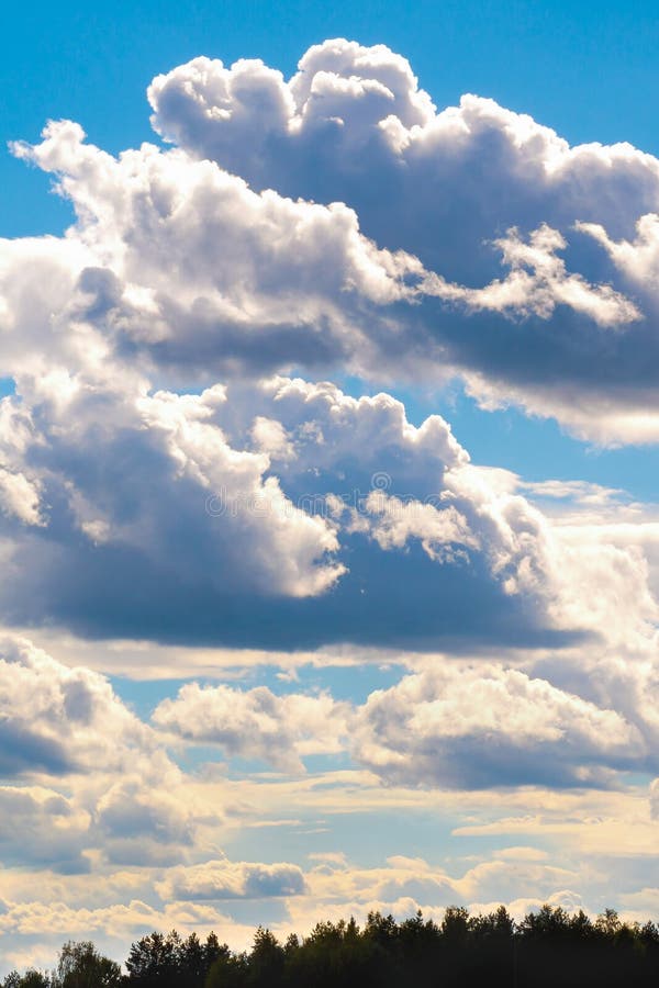 The Sky is in Voluminous Clouds Multiple Above the Horizon Line Stock ...