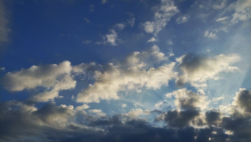Sky with White and Grey Clouds, Sunlight Breaking through between the ...