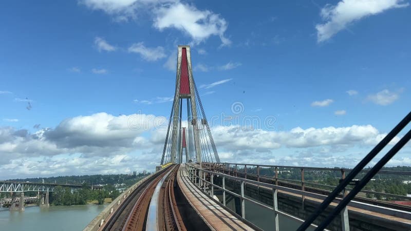 Skybridge TransLink Back Window Train on the Bridge Another Blue Train ...