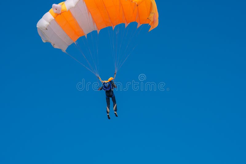 Skydiver is Flying with Parachute in Blue Sky Stock Photo - Image of ...