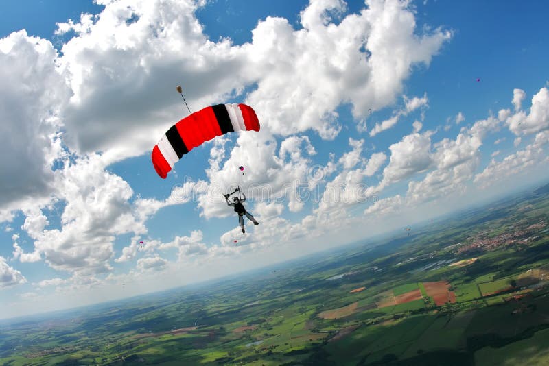 Skydiver Landing Her Parachute on the Ground. Stock Image - Image of ...