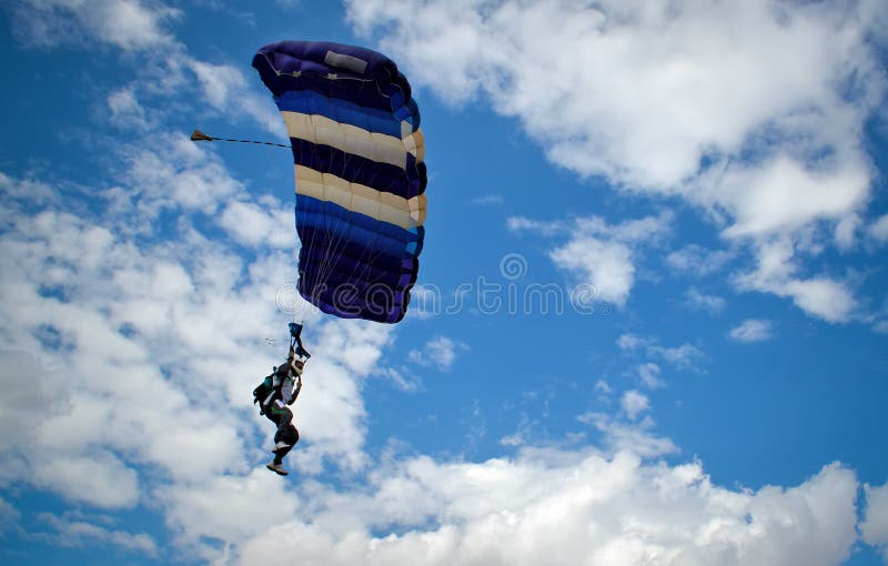 Skydiver Landing Her Parachute on the Ground. Stock Image - Image of ...
